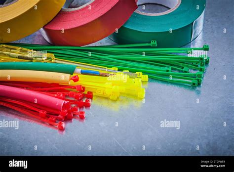 Insulating Tapes Plastic Cable Ties Electrical Wires On A Metallic