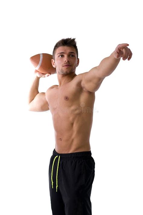Muscular American Football Player Standing With Ball In Hand Stock