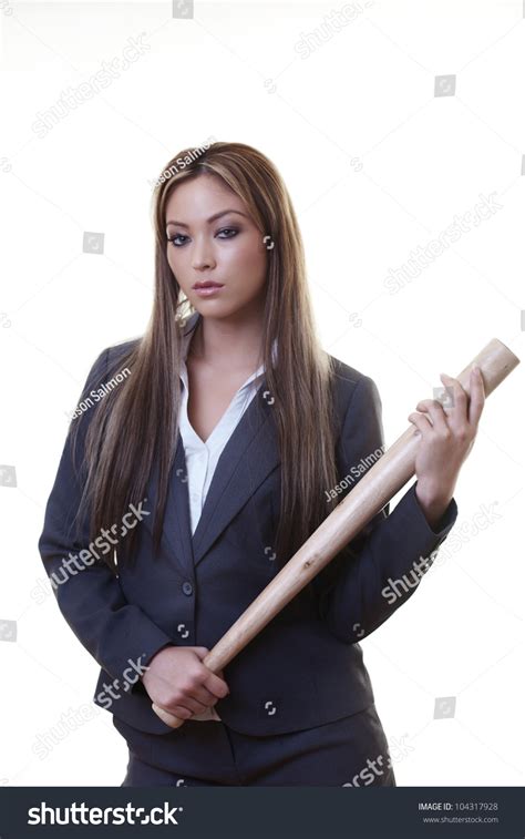 Woman Holding A Baseball Bat As If She Is About To Hit Someone Or Some