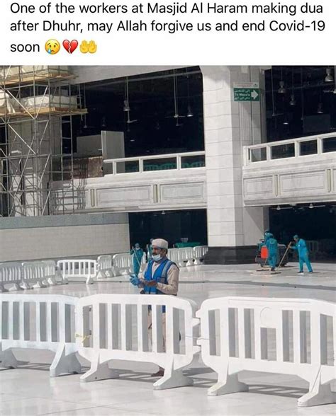 Two People Sitting On Benches In Front Of A Building With Scaffolding