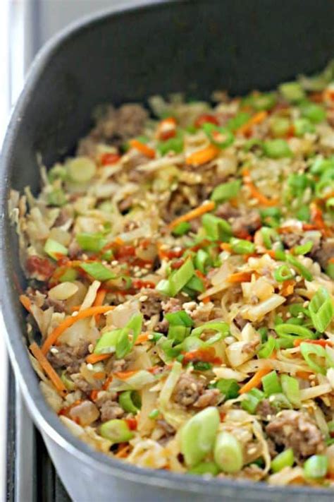 A Pan Filled With Food Sitting On Top Of A Stove