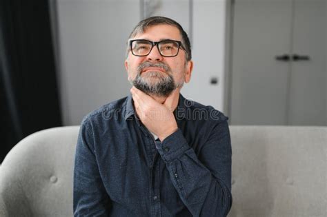 Illness And Disease Concept Sick Mature Aged Man Feeling Sore Throat