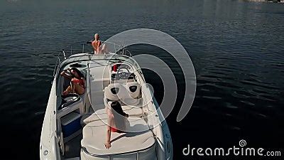 Aerial View Three Lovely Women Are Resting On A Motor Boat Models In