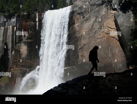 A Man Hikes Along The Mist Trail To Vernal Fall In Yosemite National
