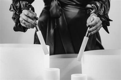 Premium Photo Playing Tibetan Crystal Singing Bowls In Sound Healing