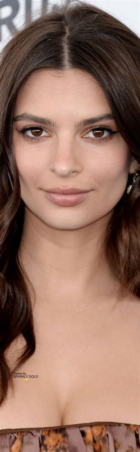 A Close Up Of A Person With Long Hair And Brown Eyeshadow Wearing An