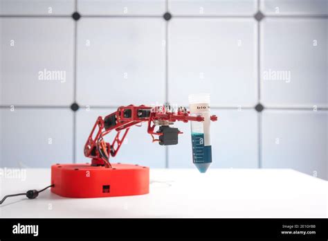 Robot Arm With Test Tube With Biological Sample In Science Laboratory