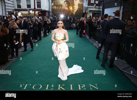 Actress Lily Collins Poses For Photographers Upon Arrival At The