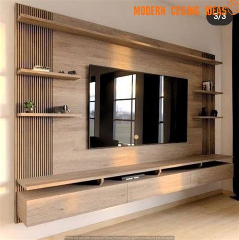 A Living Room With A Large Tv On The Wall And Shelving Units In Front Of It