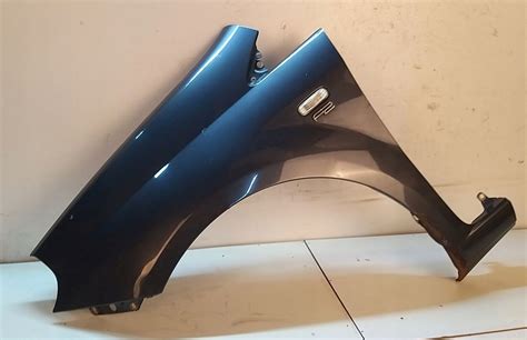 FIAT GRANDE PUNTO BŁOTNIK LEWY 13482261844 oficjalne archiwum Allegro
