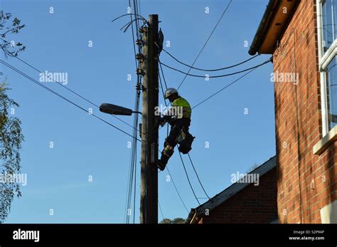 Man Up Telegraph Pole Stock Photo Alamy