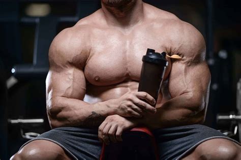 Brutal Strong Bodybuilder Athletic Men Pumping Up Muscles With