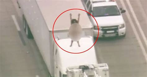 Naked Woman Brings Traffic To Standstill As She Climbs Up On Lorry To