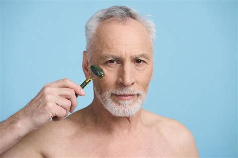 Premium Photo Closeup Caucasian Senior Man Massaging Face With
