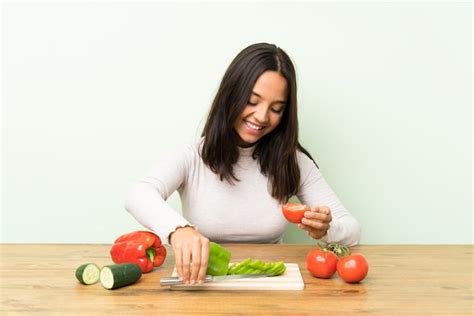 Premium Photo Young Brunette Woman With Lots Of Vegetables