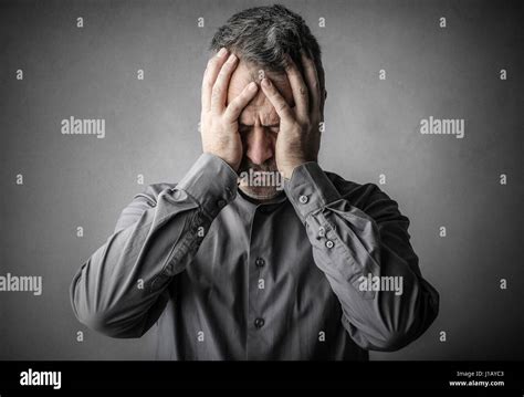 Depressed Man Holding His Head Stock Photo Alamy