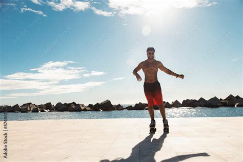 Foto De Black Man On Roller Skates Riding Outside Urban Man Posing