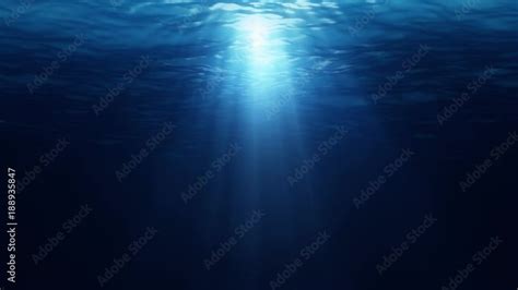 Sunlight Rays Shining Through Ocean Surface Dark Blue Underwater