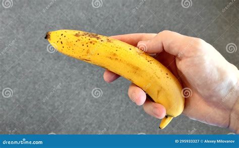 Man Holding A Ripe Banana In His Hand Stock Video Video Of Indoors Eating 295933327