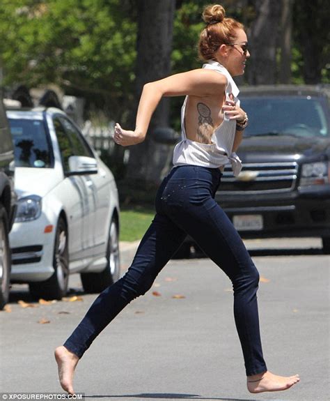 Miley Cyrus Bares All With A Peek A Boo Top Delighting In The Joys Of