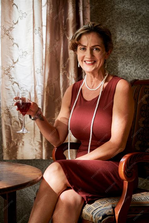 Premium Photo Portrait Of Happy Elegant Mature Woman With Pearl Necklace Enjoying Glass Of Red