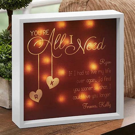 A Lighted Sign That Says You Re All I Need Is Love And Two Hearts