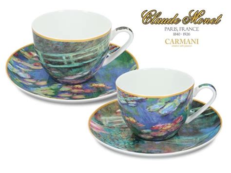 Two Cups And Saucers With Water Lilies On Them