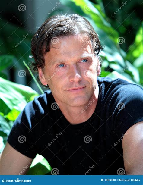Handsome Middle Aged Man Looking Pensive In The Sun Royalty Free Stock