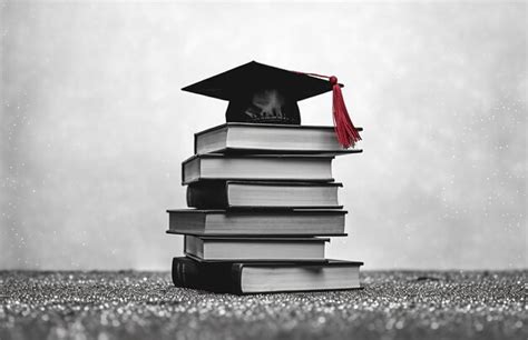 Premium AI Image Graduation Cap Against Pile Of Books