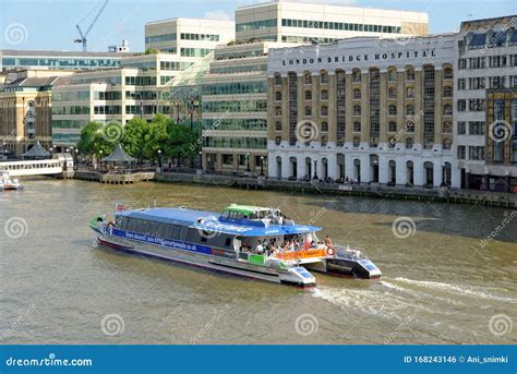 A City Cruises Tour Boat Sails On The Thames River Near London Uk
