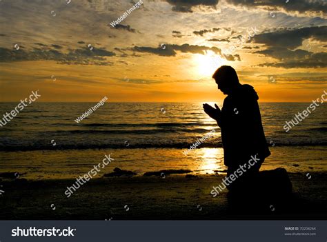 Man Kneeling Praying Ocean His Head Stock Photo Shutterstock