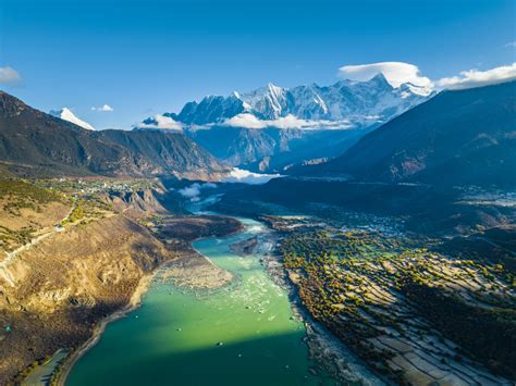Snow Capped Mountains Atop Golden Forest In World S Largest Canyon CGTN