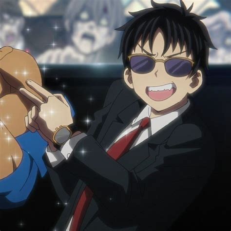 Two People In Suits And Sunglasses One Is Pointing At The Other