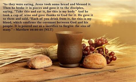 A Cup And Some Bread On A Table With The Words They Were Eating Jesus