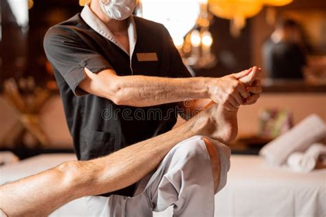 Masseur Doing A Deep Massage To A Male Client Stock Image Image Of Salon Person 203446485