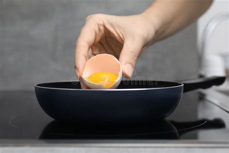 Woman Breaking Egg Into Frying Pan Closeup Stock Image Image Of