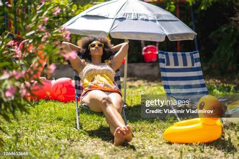 Woman Sunbathing In Backyard Photos And Premium High Res Pictures Getty Images