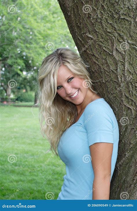 Portrait Of A Young Beautiful Blonde Model Leaning On A Tree Stock Image Image Of Date Face