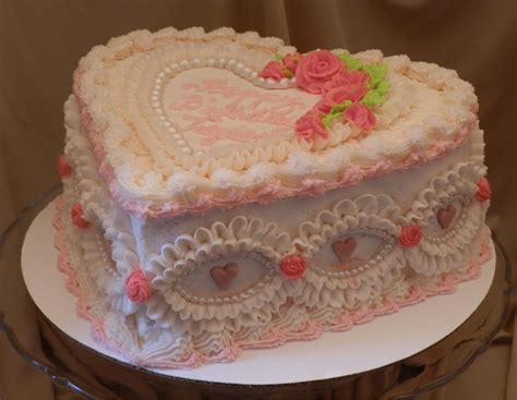 A Heart Shaped Cake Sitting On Top Of A Table