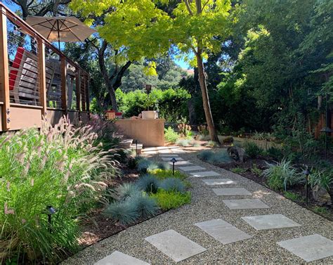 Serene Landscape Under Oak Trees With Travertine Stone Patios And