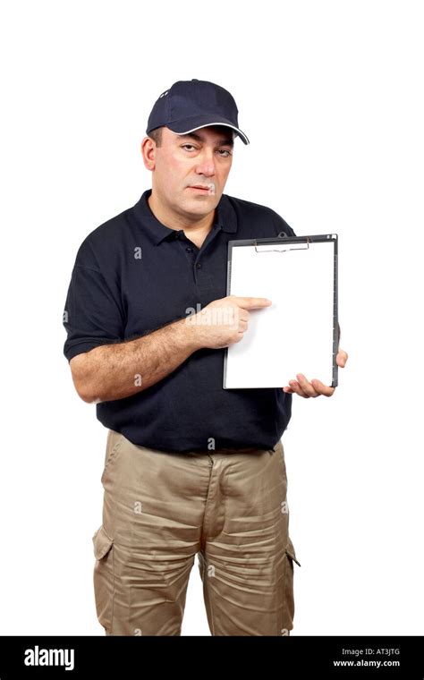 Courier Holding A Clipboard And Pointing With The Finger Stock Photo