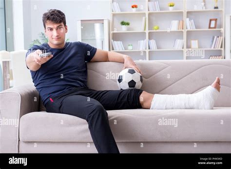 Man With Broken Leg Recovering At Home Stock Photo Alamy