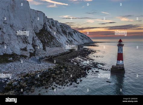 Beautiful Summer Sunrise Landscape Image Of Beachy Head Lighthouse In