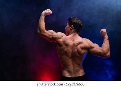 Muscular Man Showing Muscles Isolated On Stock Photo