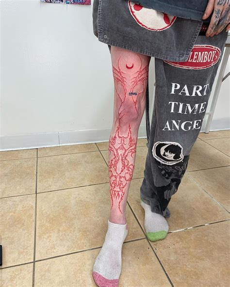 Grimes Gets Massive Red Leg Tattoo From Ankle To Thigh