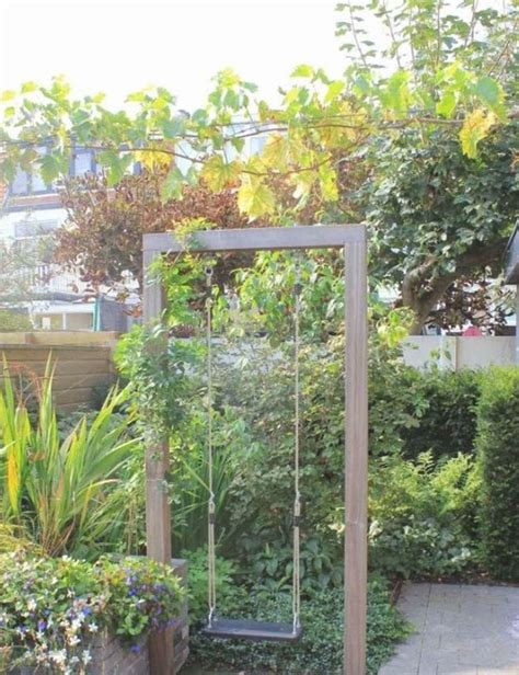 An Outdoor Garden With Lots Of Plants And Trees