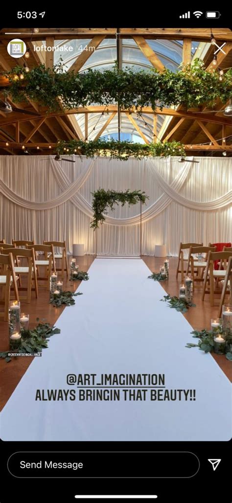 An Image Of A White Aisle With Greenery And Candles On It That Says Art