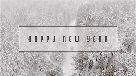 Auld Lang Syne Slow Drive Into Scenic Mountain With Snow Falling