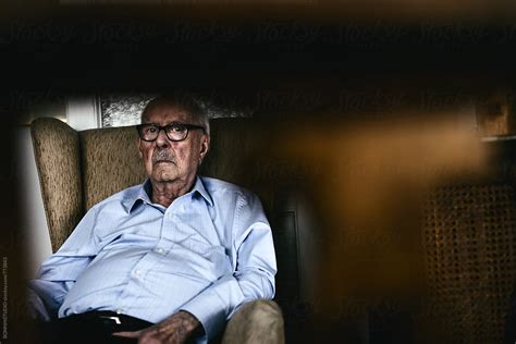 A Years Old Man Grandfather Sitting On A Couch At Home By