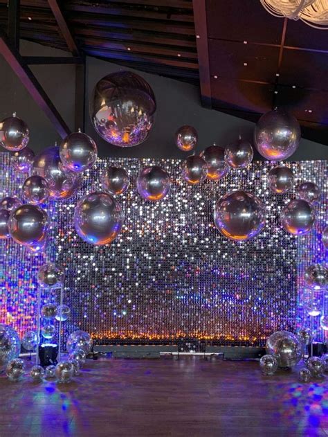A Large Room Filled With Lots Of Shiny Silver Balls And Disco Ball